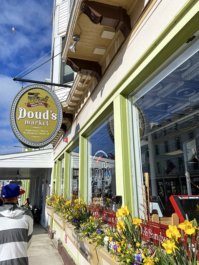 Doud's cheerful exterior stands as a welcoming beacon on Main Street, where spring flowers hint at the island's seasonal rebirth.