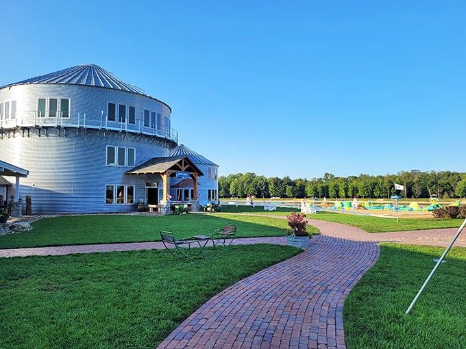 Summer's perfect expression: a distinctive silver structure against blue skies, green grass, and the promise of cool waters just steps away.