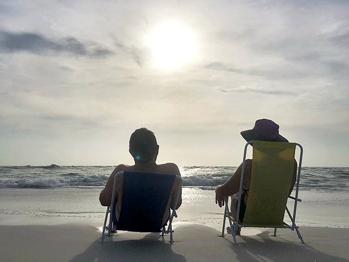 Sunset Beach Chair Relaxing: The perfect ending to a Bean Point day &ndash; two souls soaking in the golden hour, proving the best things in life aren't things.