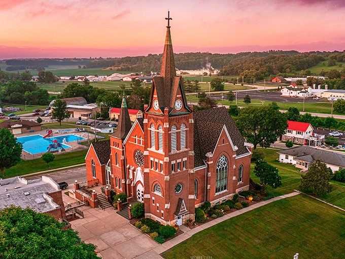 Swiss United Church of Christ This magnificent brick church with its soaring steeple stands as a spiritual landmark, bathed in the golden light of sunset.