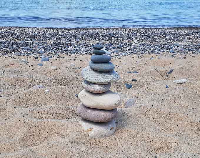 Balanced stones mark a visitor's meditation spot &ndash; temporary art that speaks volumes about finding equilibrium in natural spaces.