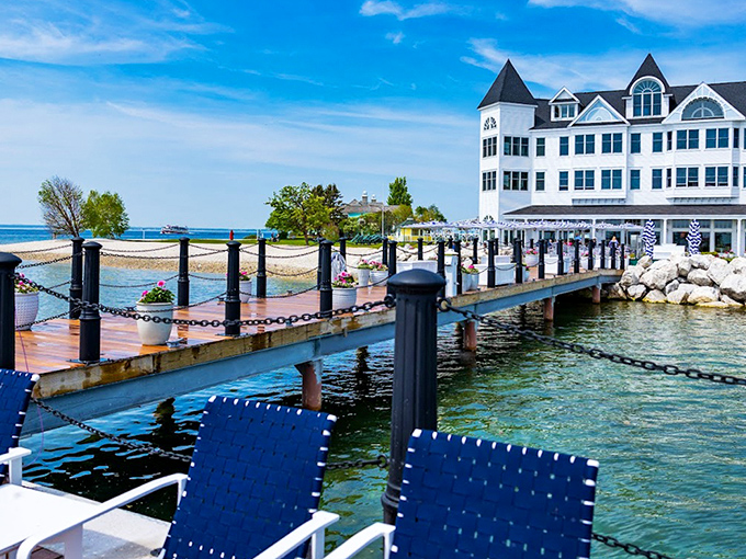 The hotel's private dock extends like an invitation into Lake Huron's crystal waters, promising adventures beyond the shore.