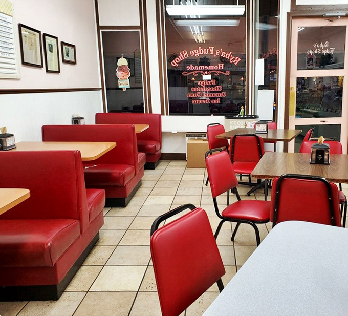 Classic diner-style seating offers a comfortable spot to contemplate the profound life decisions that led to your fudge acquisition. No regrets here!