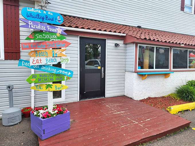 Directional signs point to "Paradise Found" and "No Worrying Allowed"—the perfect introduction to your temporary island getaway.