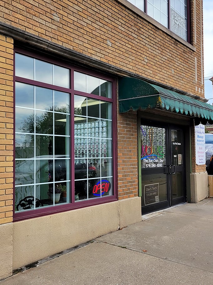 The unassuming exterior gives little hint of the transformative experiences waiting just beyond those brick walls and purple doors.