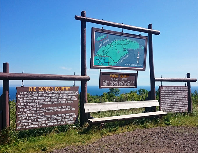 History stands preserved in rustic signage, telling tales of ancient copper miners and geological wonders that shaped this magnificent peninsula.