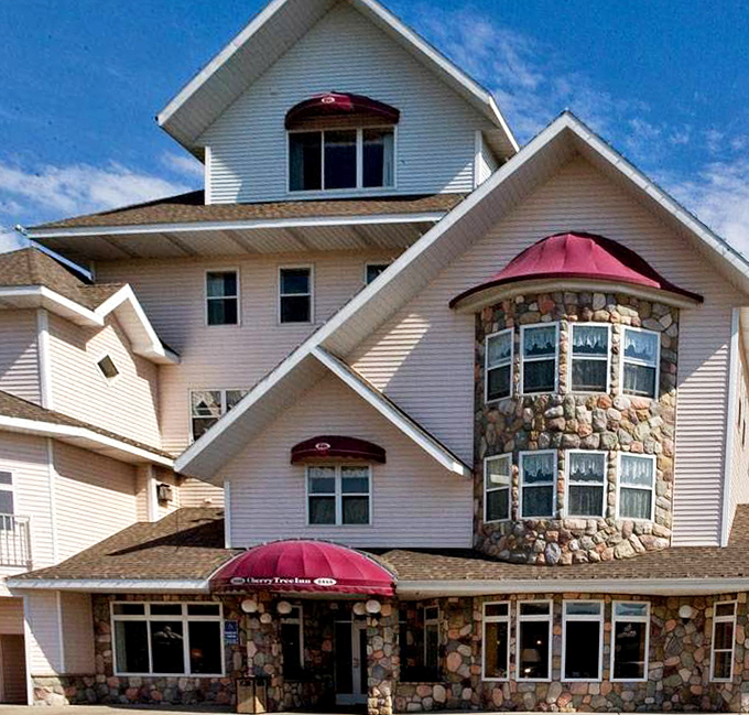 Twilight transforms the hotel's fa&ccedil;ade into a glowing beacon of comfort, while balconies promise private viewing of nature's nightly show.
