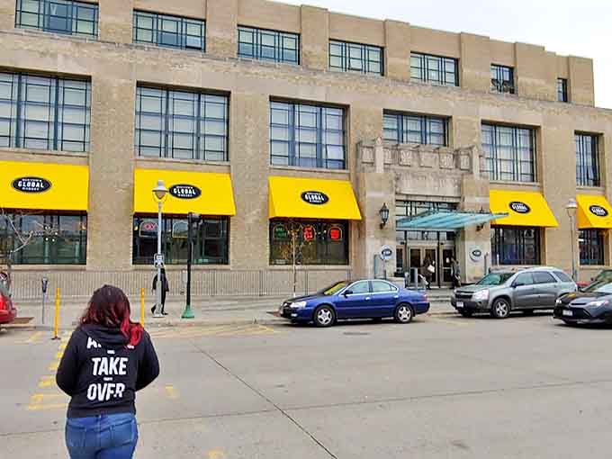 From the outside, you'd never guess that the entire world is waiting just beyond those doors and yellow awnings.