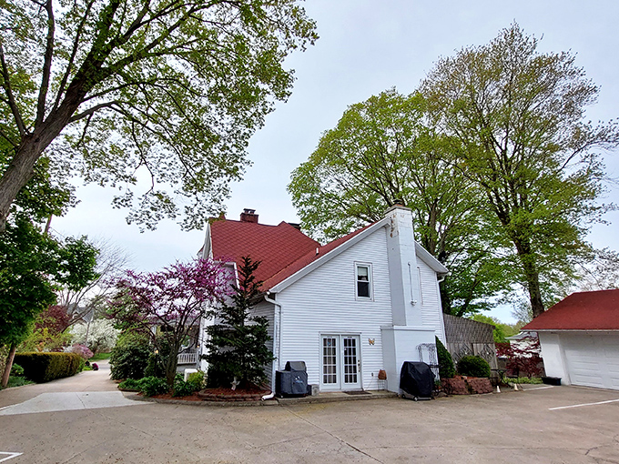 The side view reveals the home's impressive scale and thoughtful design, where even utility doors get the Victorian treatment.