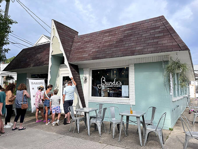 Summer crowds line up outside the distinctive mint-green building, a testament to pastries worth waiting for and vacation memories in the making.
