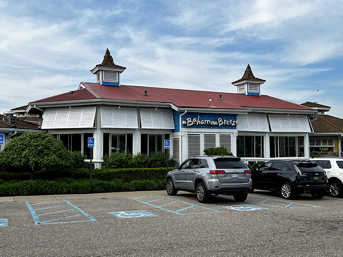 Even the parking lot view promises an escape – that red roof signaling "tropical paradise ahead" to weary Michigan travelers.