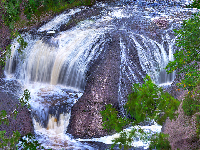 Winter transforms Potawatomi Falls into a magical ice sculpture garden where flowing water and frozen formations create ever-changing art.