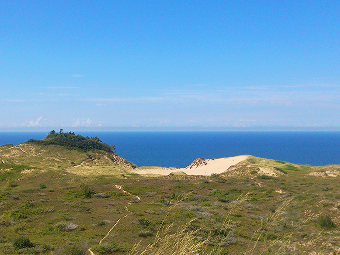 Rolling dunes meet endless horizon, creating a landscape that feels more like a painting than reality.
