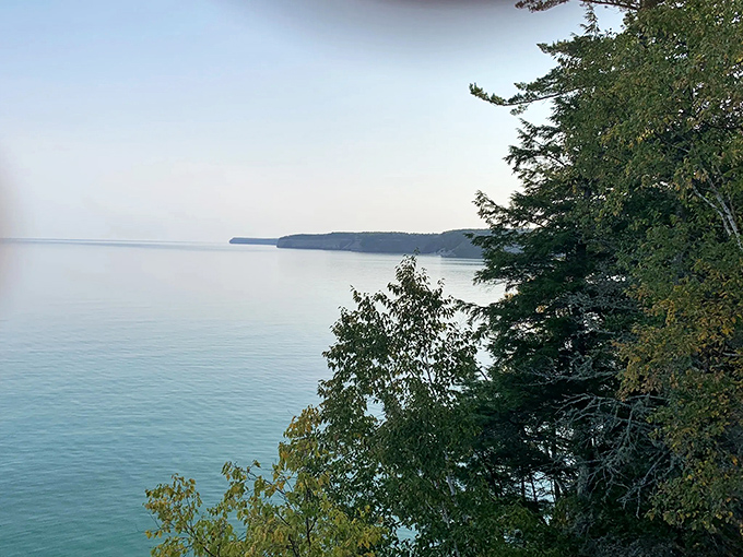 Lake Superior stretches to the horizon like nature's infinity pool, a reminder that Michigan's wonders extend as far as the eye can see.