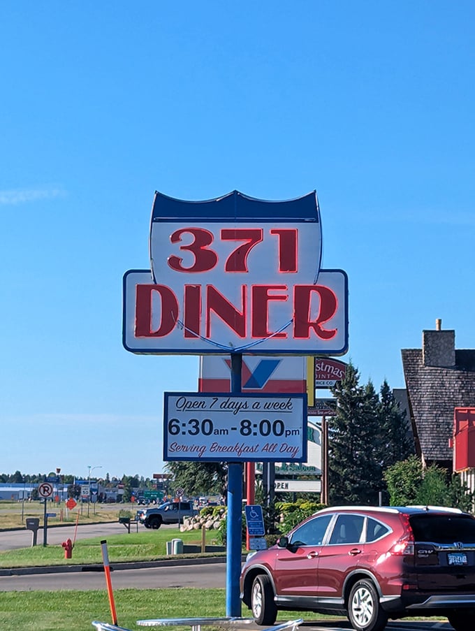 The iconic 371 Diner sign stands tall, a beacon of hope for hungry travelers seeking salvation from fast food mediocrity.