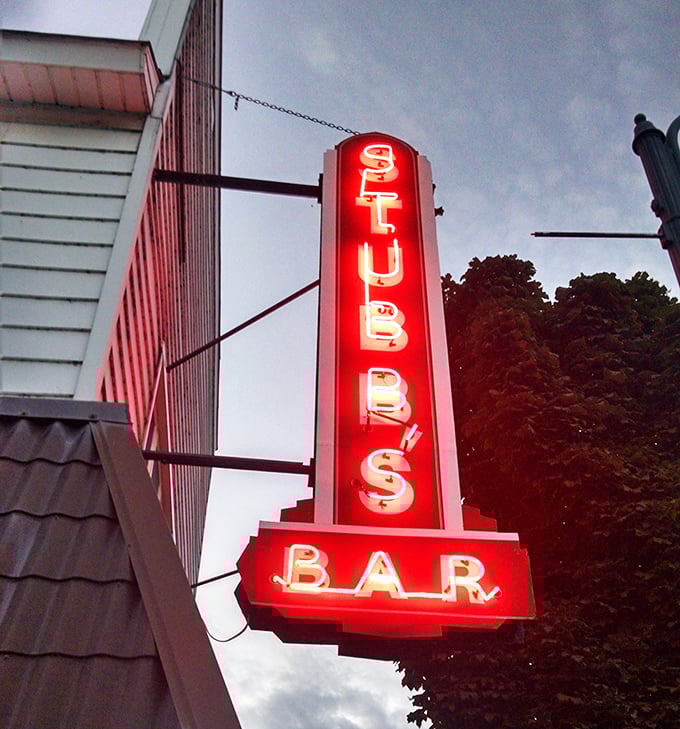 The vertical "STUBBS BAR" sign has guided thirsty travelers for generations, a beacon of hospitality in this corner of Wisconsin's north woods.