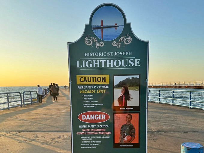 Safety first! This sign reminds visitors that while the lighthouse pier offers unmatched beauty, Lake Michigan demands proper respect and caution.