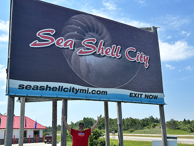 The iconic Sea Shell City sign stands tall against Michigan's blue skies, a beacon for generations of travelers seeking coastal magic in the heartland.