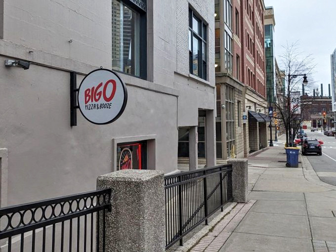 From street level, you might miss this culinary treasure &ndash; but locals know to look for the Big O' sign that promises pizza perfection below.