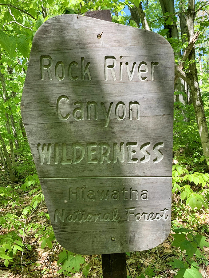 This weathered sign doesn't just mark a location – it's an invitation to adventure in one of Michigan's most pristine wilderness areas.