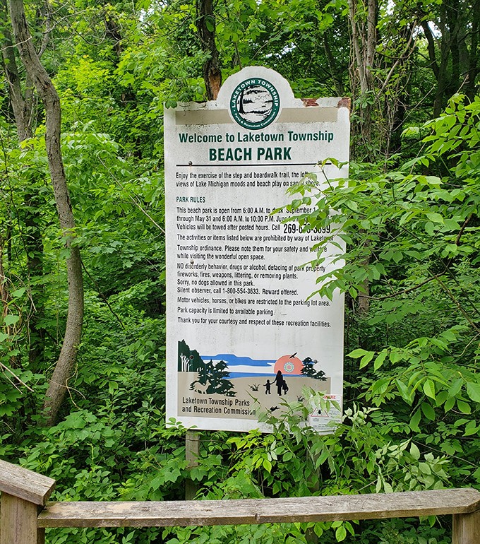 The unassuming entrance sign &ndash; nature's version of "good things come to those who climb down 157 wooden steps."