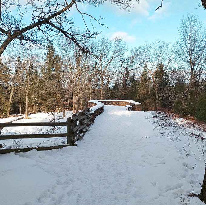 Winter transforms the overlook into a snow globe scene, proving that Mother Nature doesn't take seasonal breaks from being absolutely stunning.