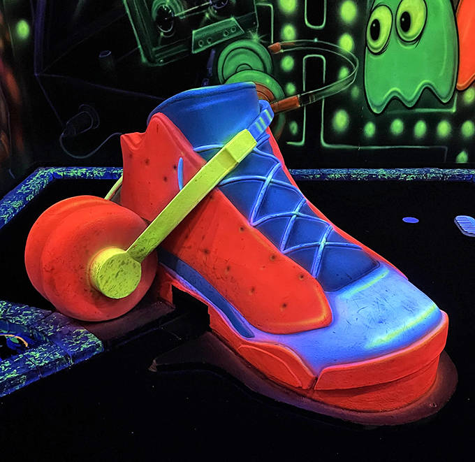 The platform shoe returns for its encore appearance, proving that in the world of blacklight mini golf, fashion obstacles reign supreme.
