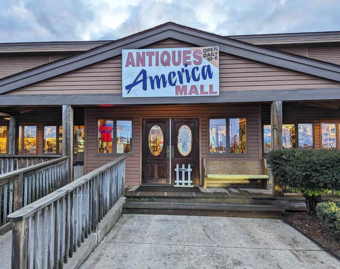 The welcoming facade of Antiques America Mall beckons treasure hunters with its rustic charm and promise of vintage wonders waiting inside.