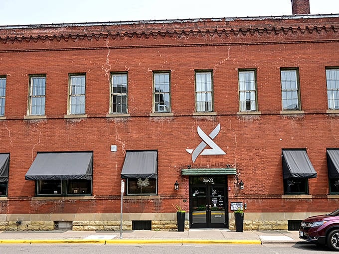 Exterior: Brick walls whisper secrets of Prohibition past, with only a subtle "X" marking the entrance to this hidden Stillwater treasure.