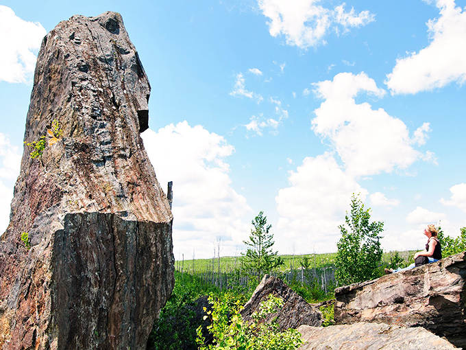Standing at the trailhead sign, adventure beckons through the northern Minnesota wilderness. The path ahead promises geological wonders and forest-bathing therapy.