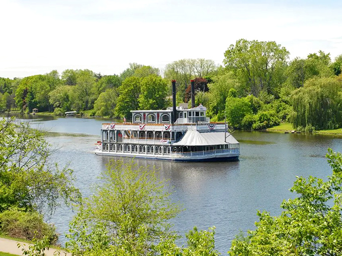 The majestic Michigan Princess glides along the Grand River, its white hull and red trim promising mystery and adventure for would-be detectives.