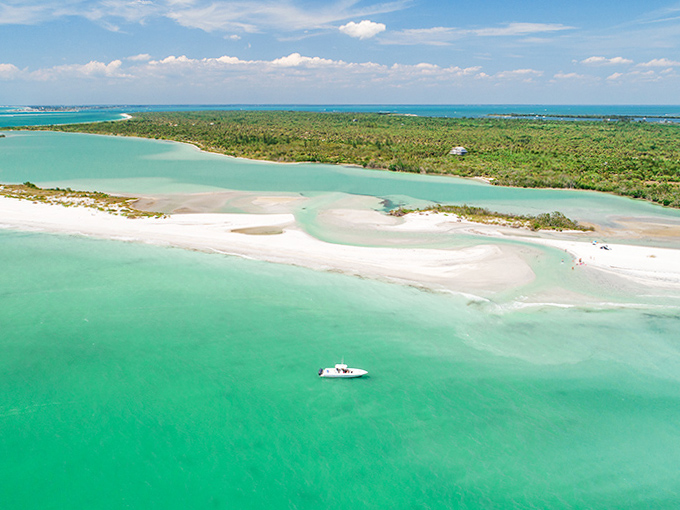 Aerial Island Coast: Bird's-eye bliss! This sliver of paradise looks like Mother Nature's attempt at creating the perfect screensaver.