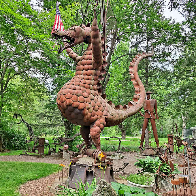 This magnificent dragon, crafted from recycled metal, stands guard at Jurustic Park with scales that shimmer in the Wisconsin sunlight.