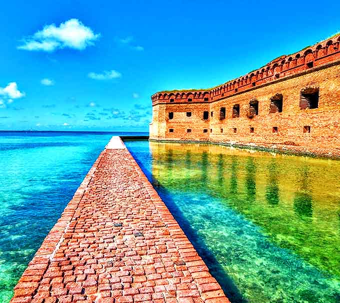 The coastal fortress stands sentinel against a backdrop of water so blue it seems digitally enhanced. Mother Nature showing off her best work.