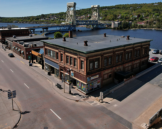 Historic buildings hug the shoreline as the Portage Lake Lift Bridge connects two worlds &ndash; a scene straight from a storybook with modern adventures waiting.