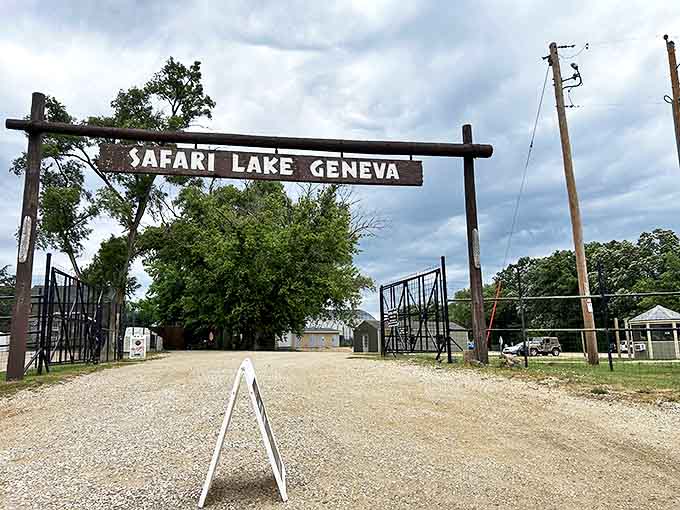 The rustic wooden entrance sign welcomes adventurers to Safari Lake Geneva, promising wild encounters just beyond its gates.