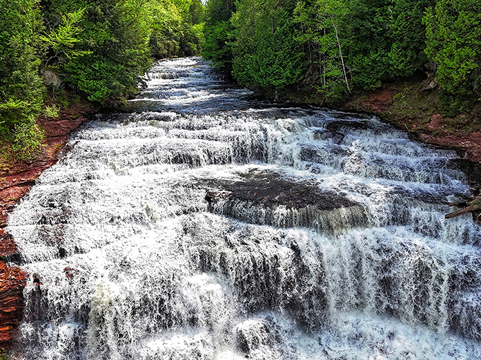 The cascading tiers of Agate Falls create nature's perfect staircase, as if the water is practicing its grand entrance.