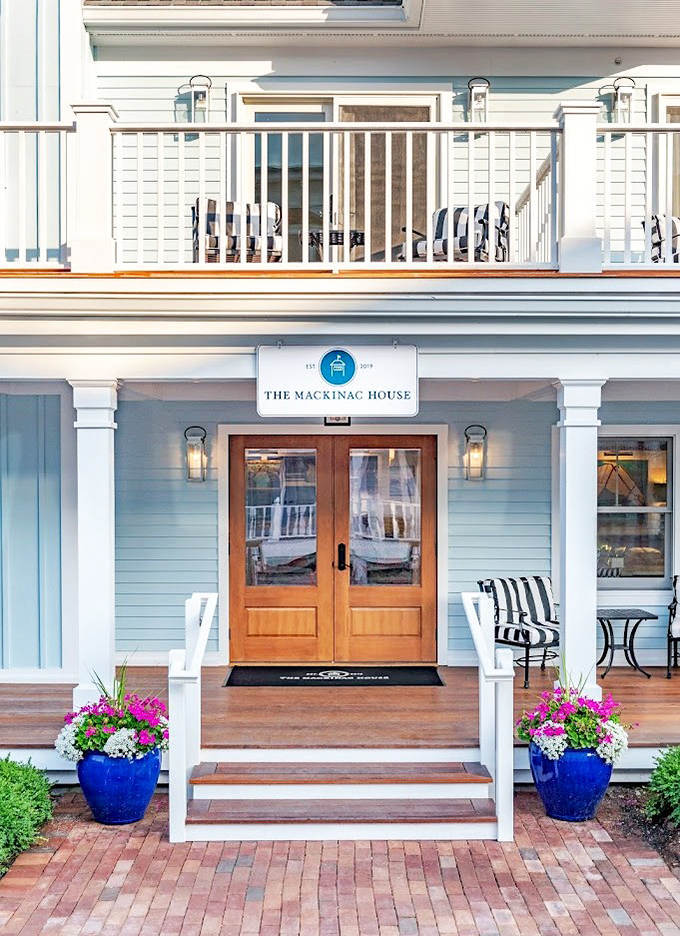 Front Entrance: Warm wooden doors flanked by vibrant flower pots create an entrance that whispers, "Leave your stress on the mainland, friend."