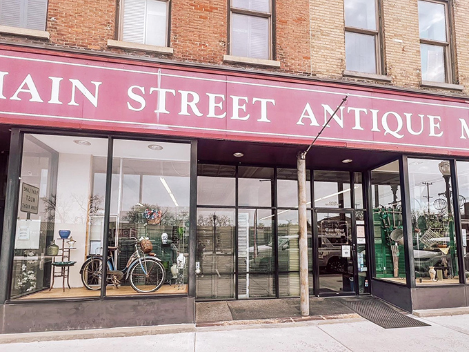 The welcoming red awning announces your arrival to treasure-hunting paradise, where the thrill of discovery awaits behind those gleaming storefront windows.