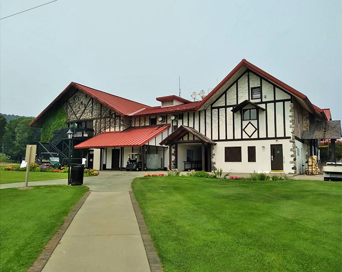 The charming Tudor-style Highlands Adventure Center welcomes visitors with its distinctive red roof and promise of outdoor thrills year-round.