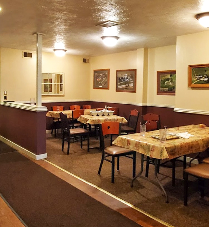 Inside, cream and burgundy walls create a cozy backdrop for wooden tables with patterned tablecloths &ndash; history you can touch while you eat.