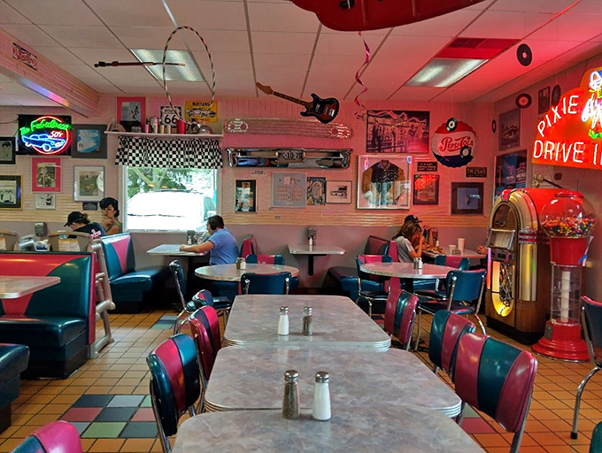 Step inside and travel back to the 1950s with checkered floors, vintage booths, and memorabilia covering every wall.