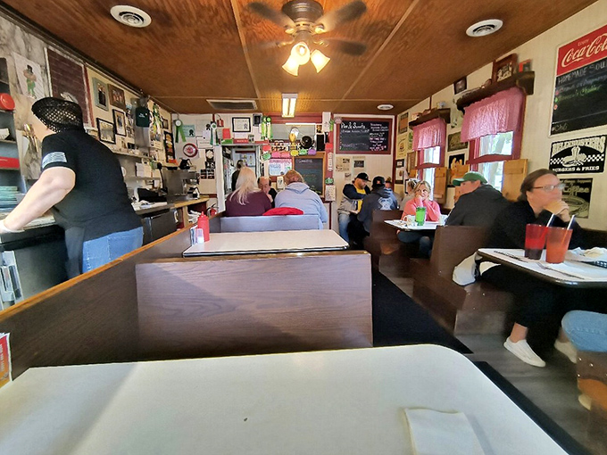 Interior: Wood-paneled walls, cozy booths, and the hum of conversation &ndash; stepping inside feels like entering a friend's living room where everyone happens to be eating incredible food.