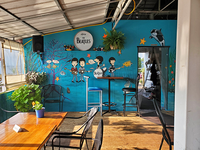 The Beatles-themed wall brings unexpected whimsy to the interior, proving good music and good food create perfect harmony.