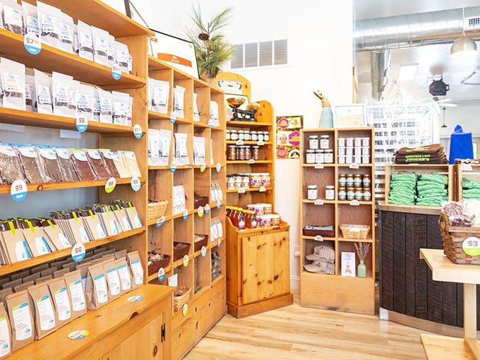 Wooden shelves lined with chocolate treasures create an inviting atmosphere where every package holds a potential new favorite.