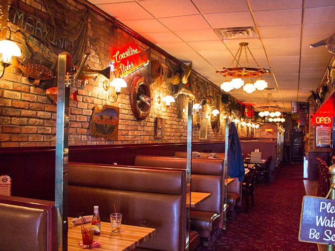 Cozy booths line brick walls adorned with nautical charm, creating the perfect backdrop for cracking into ocean delights.