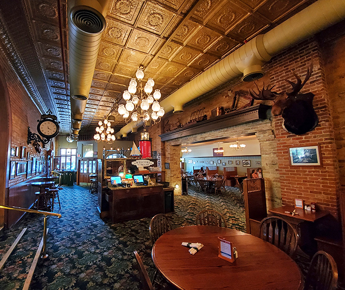 Step inside to discover exposed brick walls, ornate tin ceilings, and chandeliers that cast a warm glow over decades of dining memories.