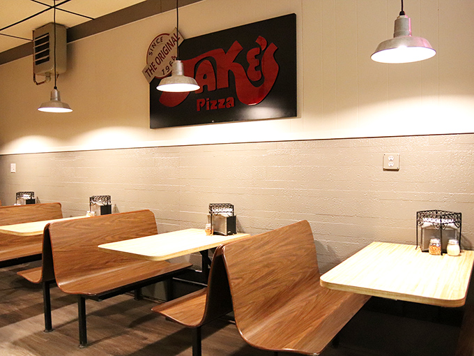 Simple wooden booths and no-nonsense decor create the perfect backdrop for pizza perfection &ndash; Jake's knows what matters most.