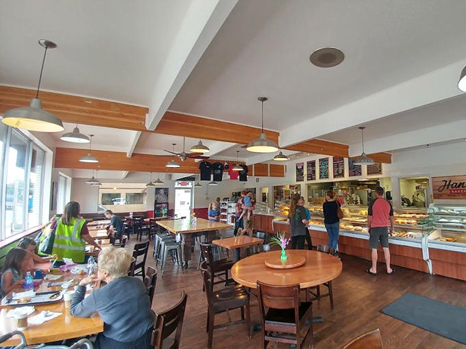 Inside Hans' Bakery, warm wood tones and pendant lighting create the perfect backdrop for sugar-fueled conversations and coffee catch-ups.
