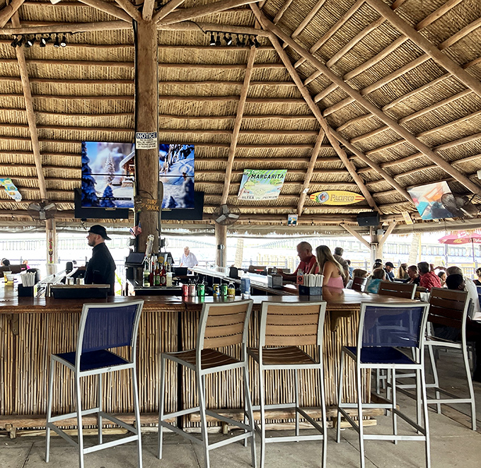 Under the thatched canopy, island vibes flow as freely as the conversation, with bamboo details that transport you straight to vacation mode.